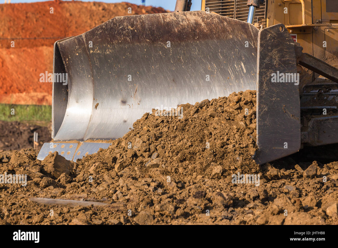 Construction industrial earthworks dozer bucket closeup sand stones c ...