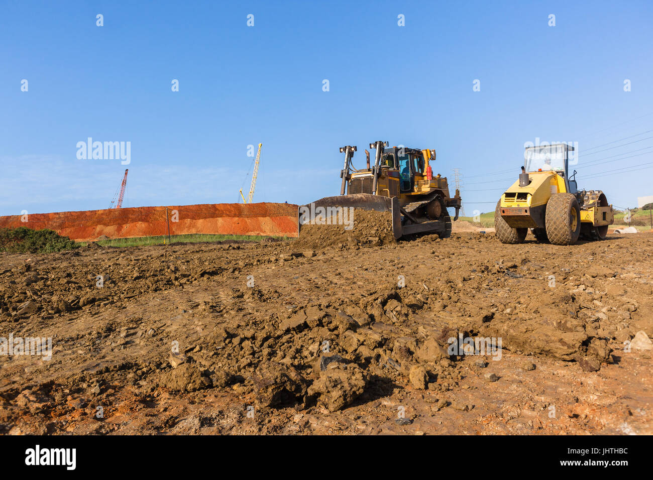 Construction industrial earthworks dozer and compactor machines eveling ...