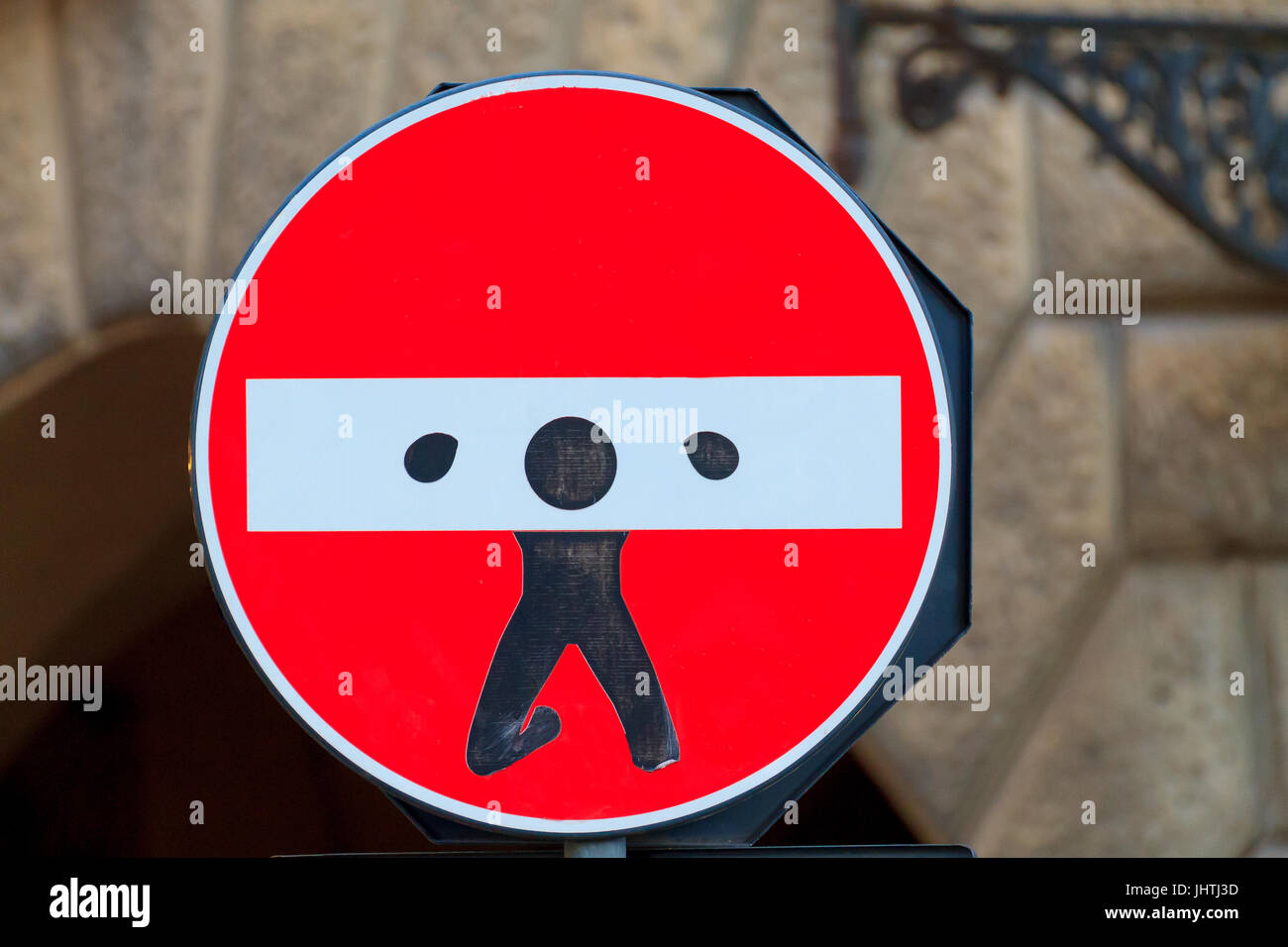 Road sign with a man on guillotine, street art, metropolitan art Stock ...