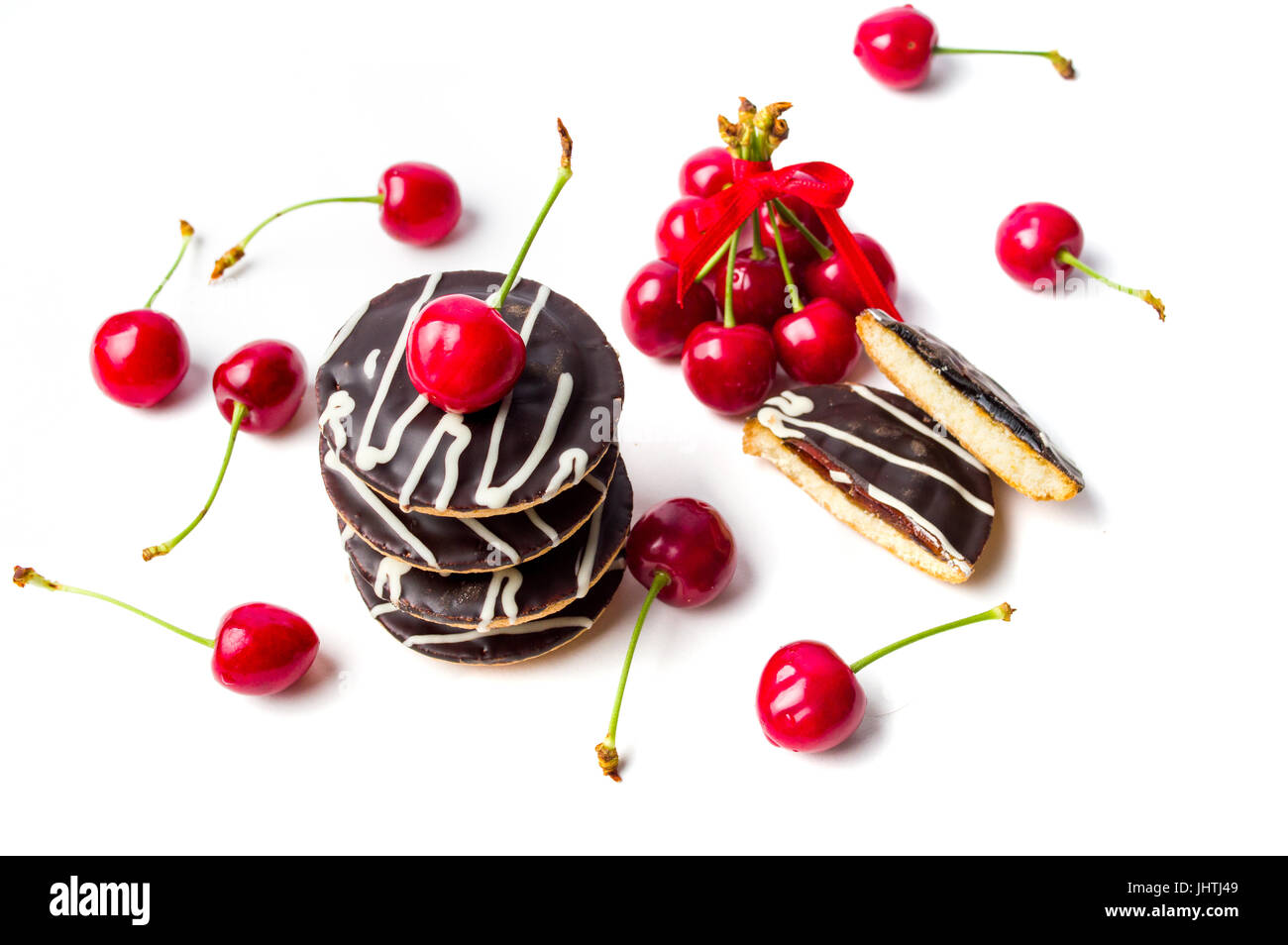 Cherry biscuits and fruits isolated on white Stock Photo - Alamy
