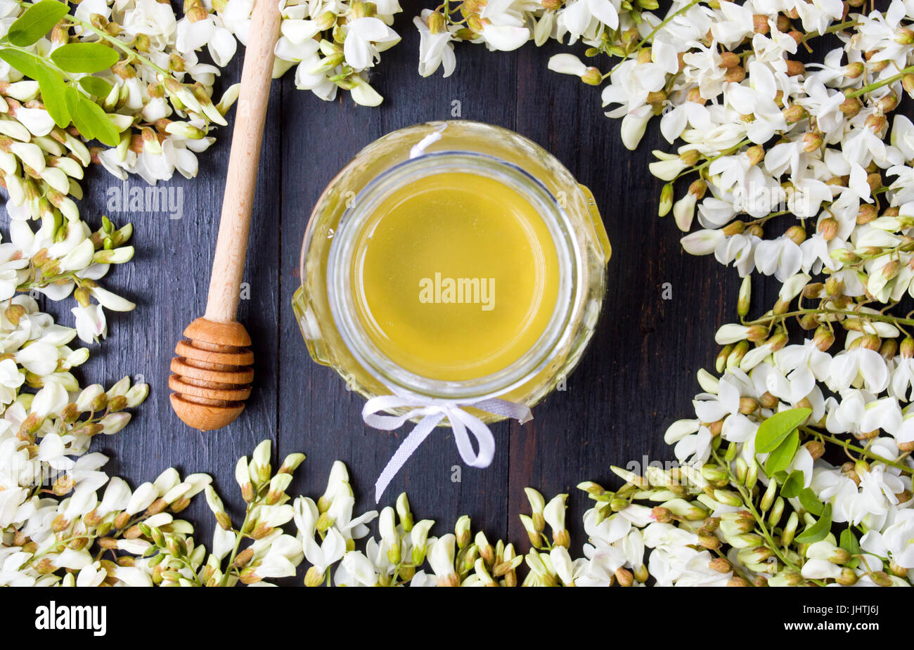 Acacia flowers and honey jar top view Stock Photo - Alamy