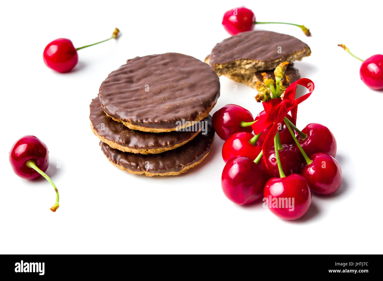 Cherry biscuits and fruits isolated on white Stock Photo - Alamy