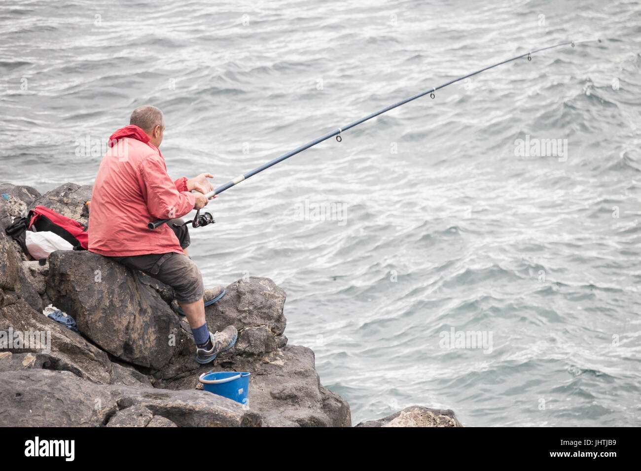 Fishing from the rocks hi-res stock photography and images - Alamy