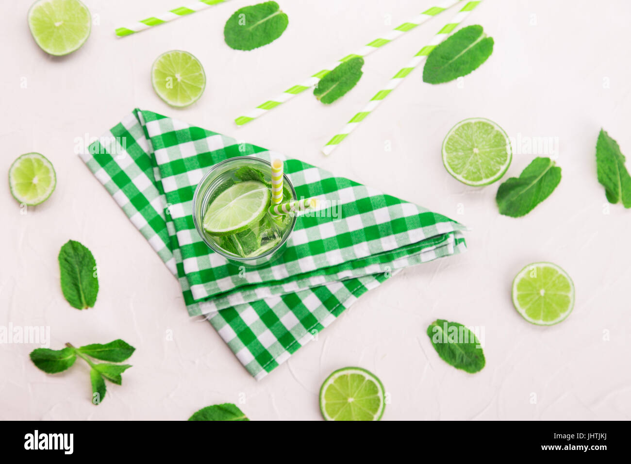 Detox water with lime and mint in glass. Mojito cocktail. on a white ...