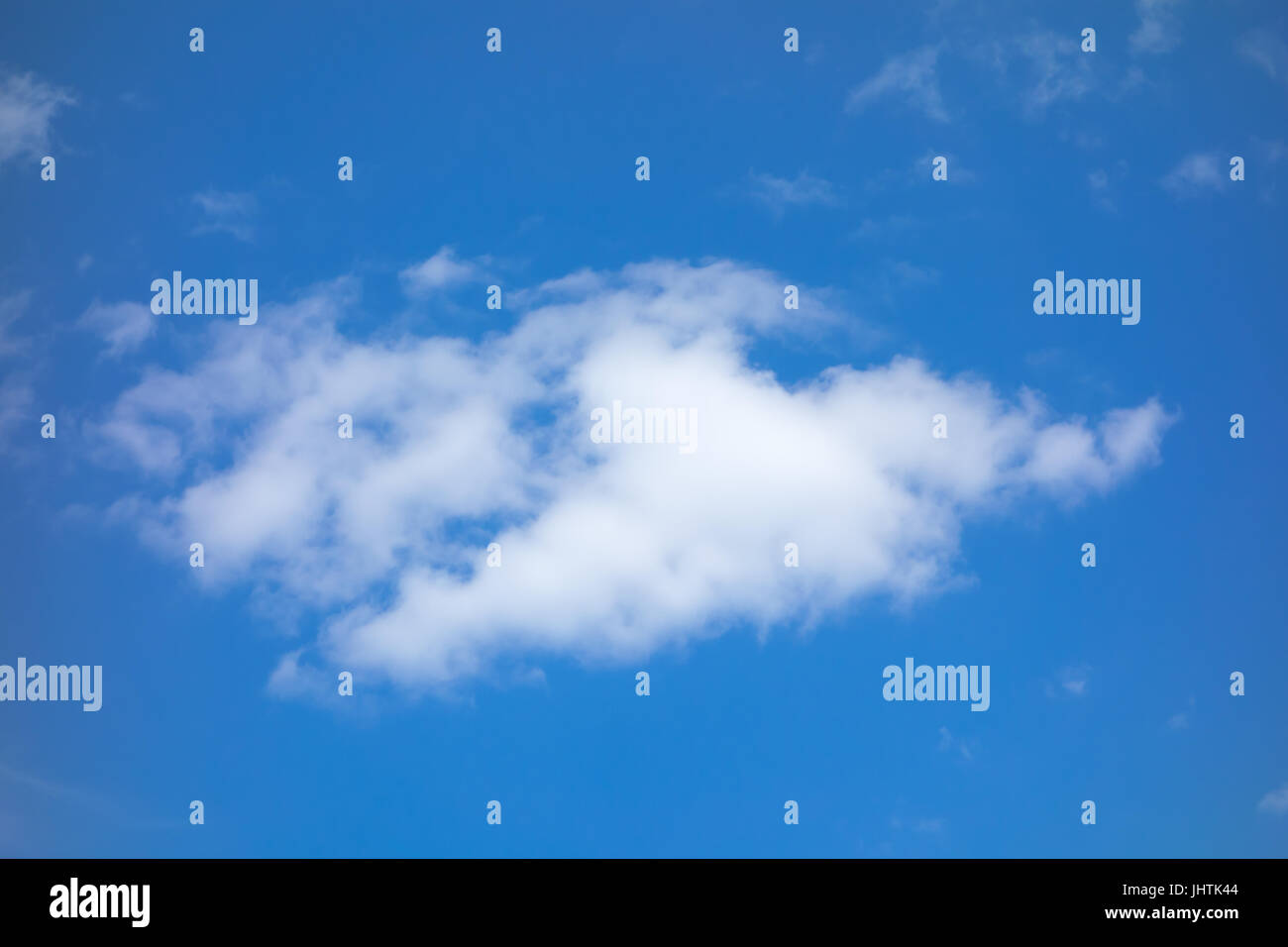 Blue sky with white light clouds in the foreground Stock Photo - Alamy