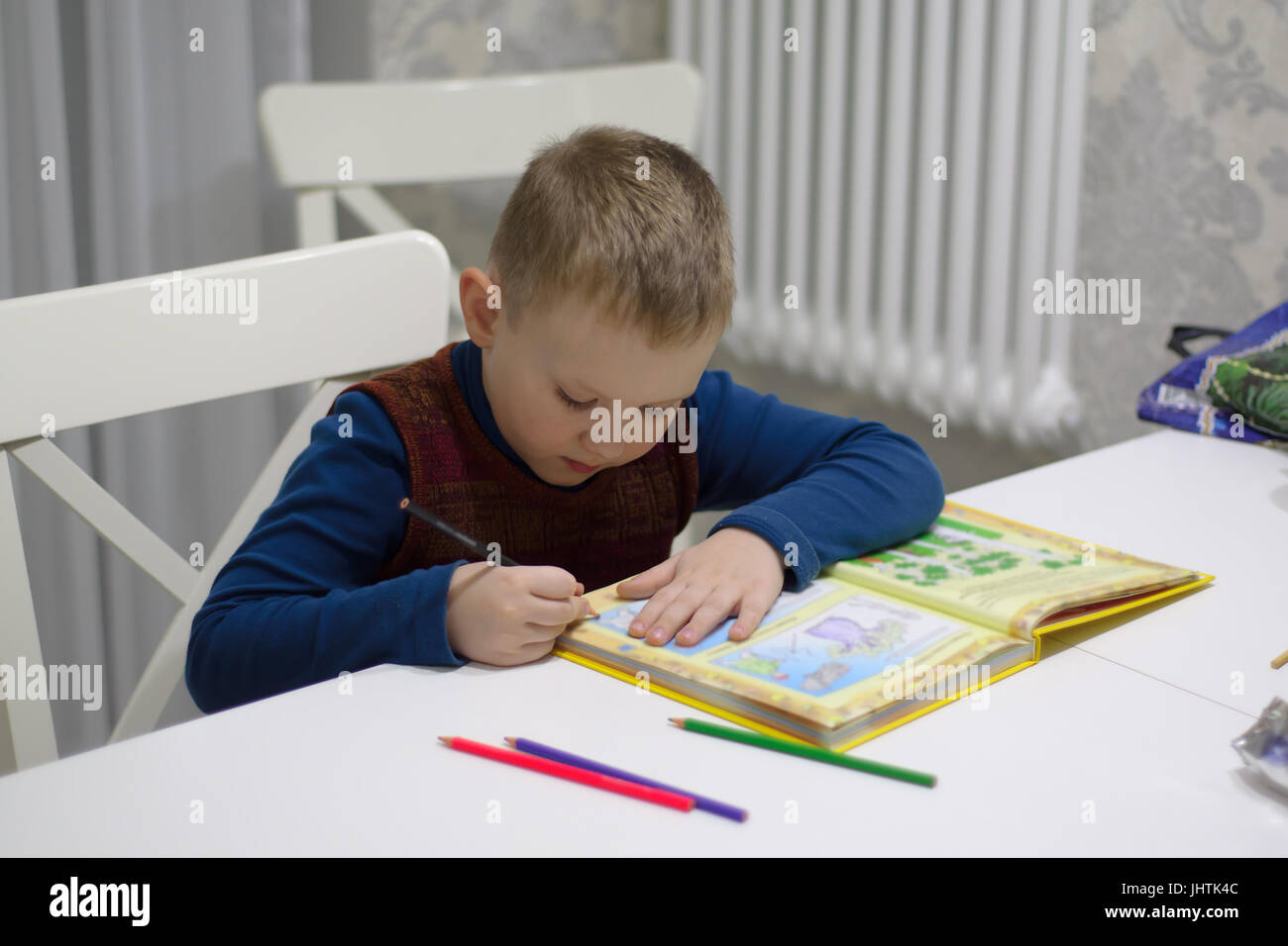 Boy reading home hi-res stock photography and images - Alamy