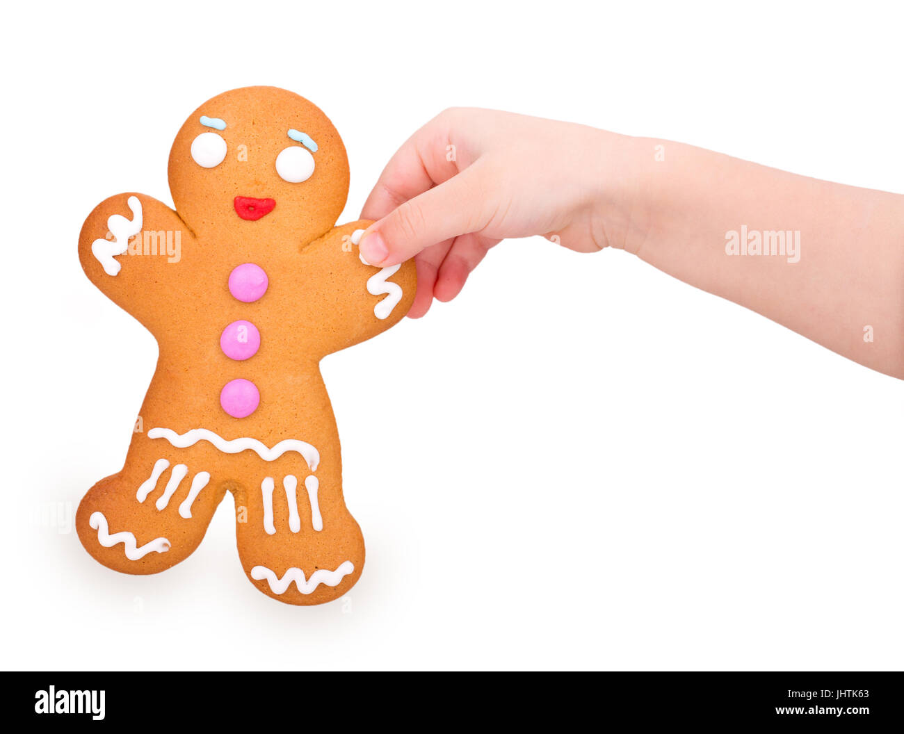 Gingerbread man in a child's hand isolated on white background Stock ...