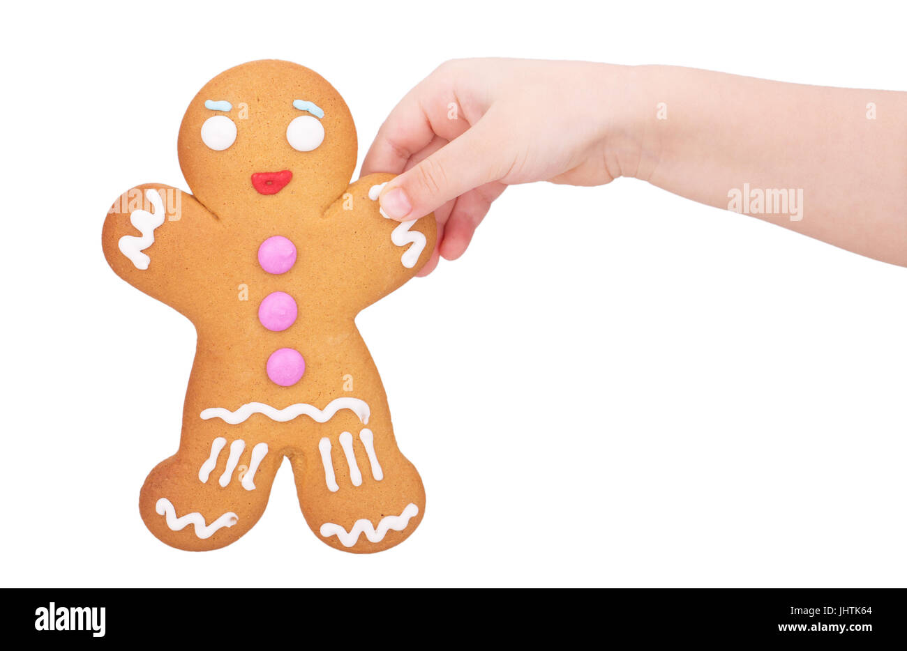 Gingerbread man in a child's hand isolated on white background Stock ...
