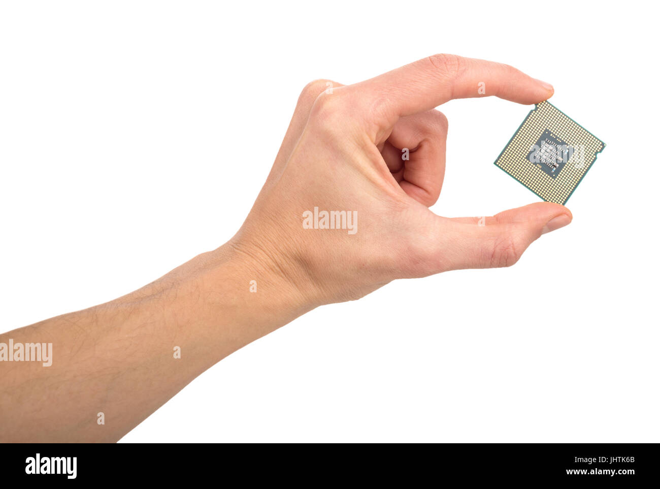 man's hand holding a computer processor isolated on white background ...
