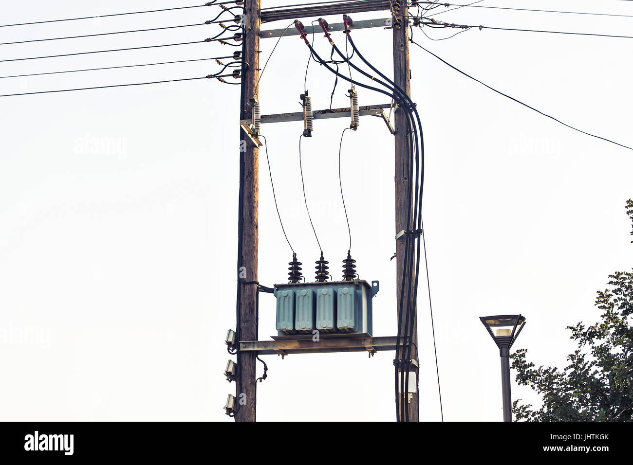 Voltage power transformer on electricity post Stock Photo - Alamy