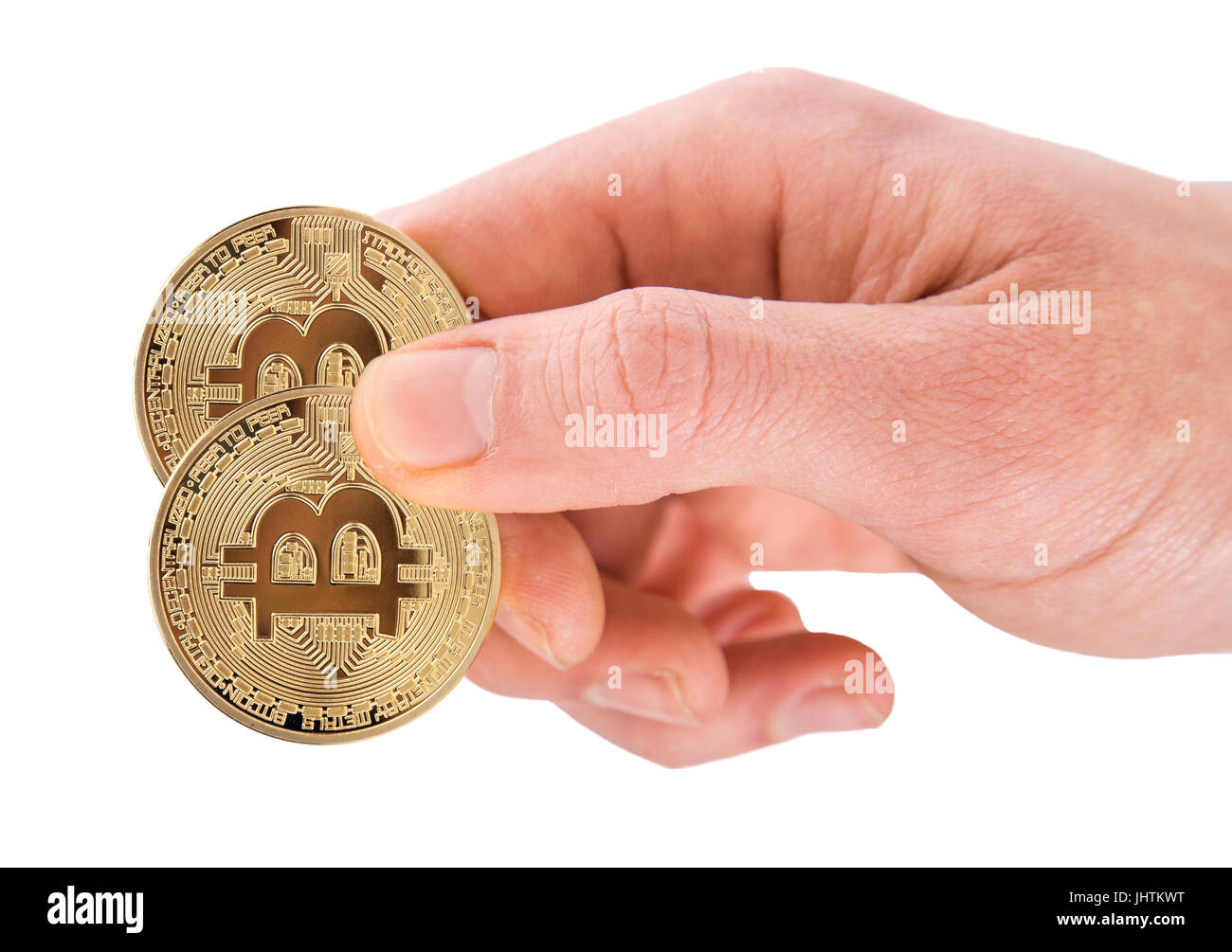 two Golden Bitcoin in a man hand. Digitall symbol of a new virtual ...
