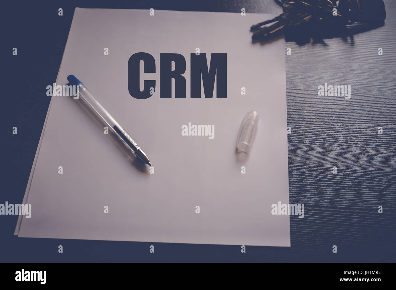 crm written on white paper on table in office, customer relationship ...