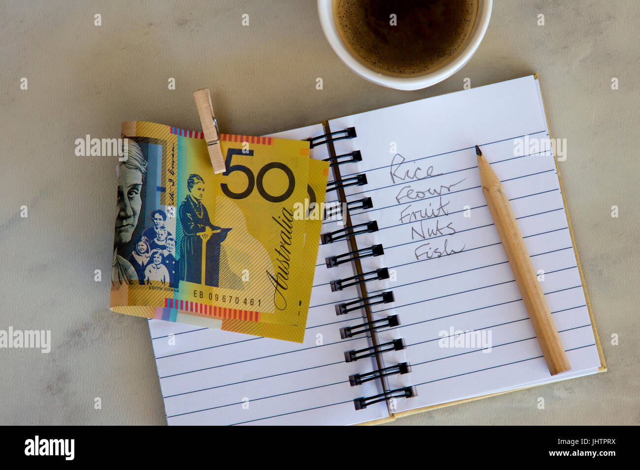 Australian dollars and a shopping list in a notebook Stock Photo - Alamy