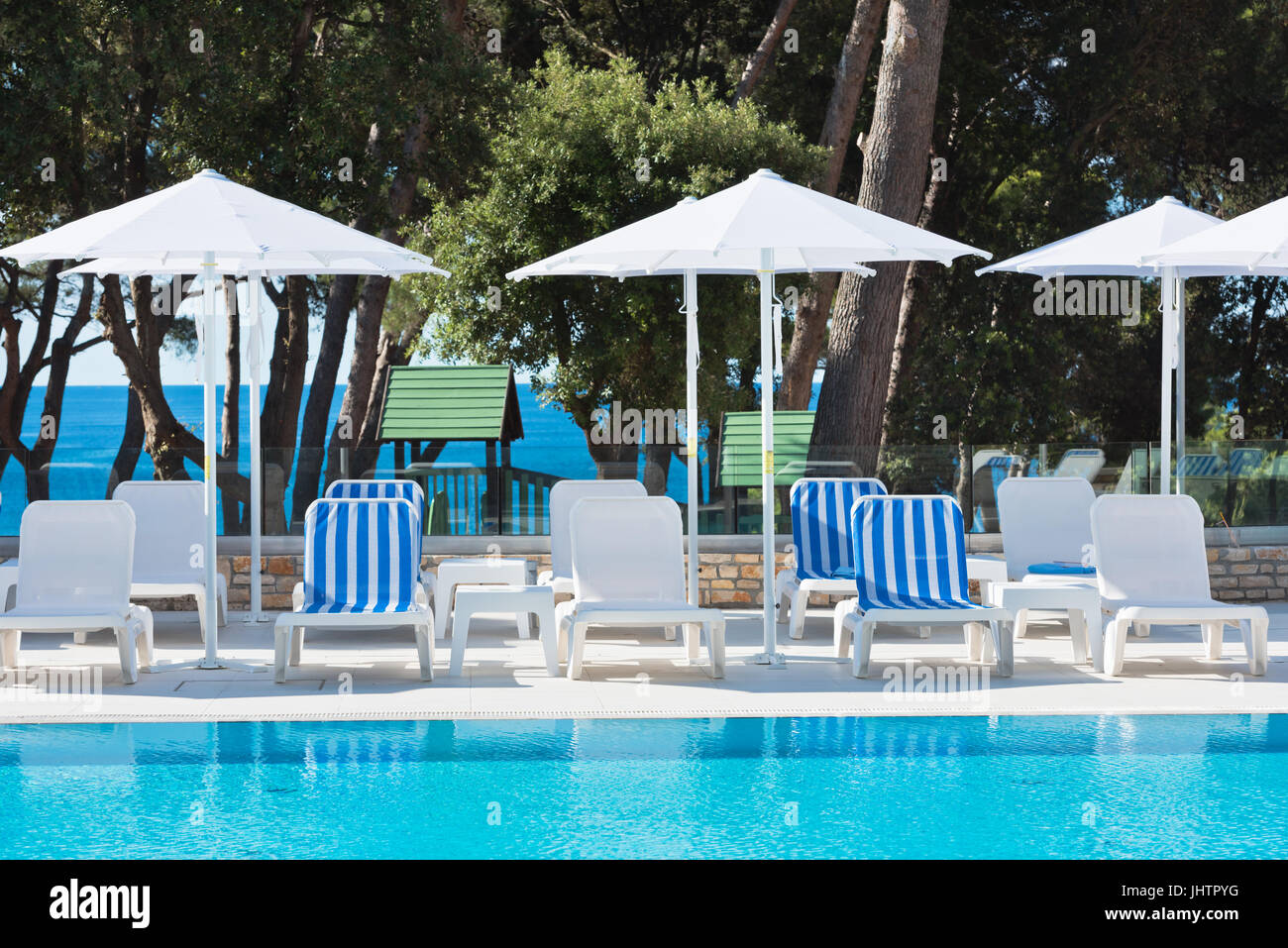 Hotel Poolside Chairs with Sea view. Summer shot Stock Photo - Alamy