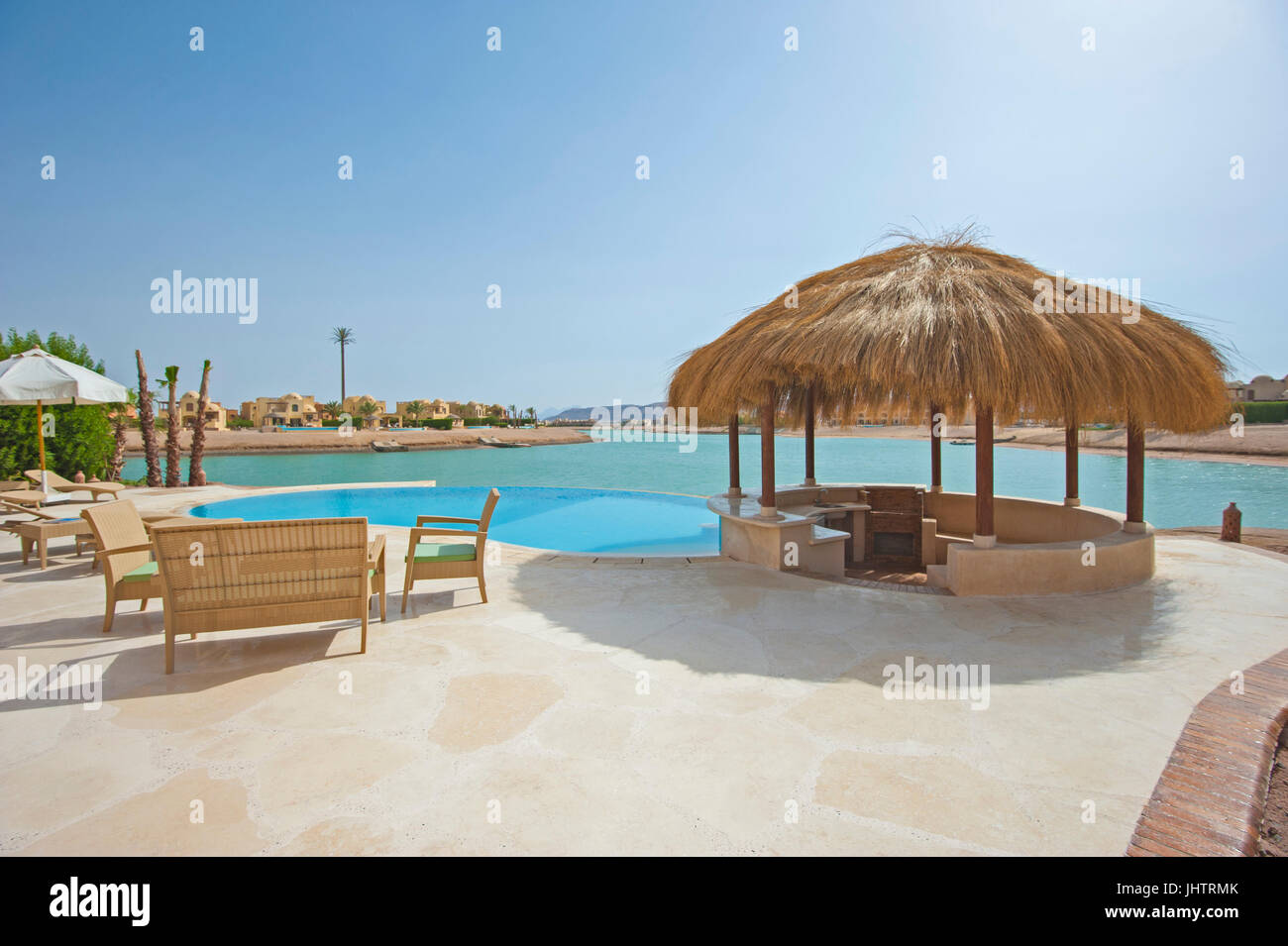 Luxury villa show home in tropical summer holiday resort with infinity ...