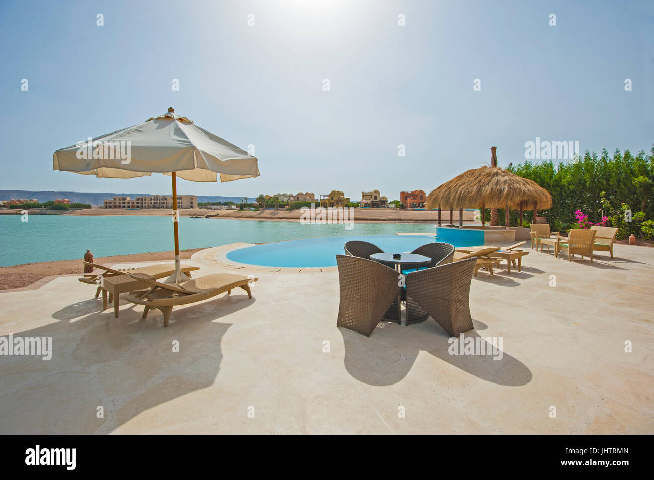 Luxury villa show home in tropical summer holiday resort with infinity ...