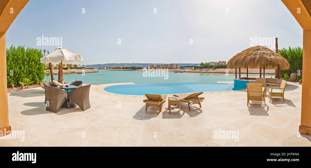 Luxury villa show home in tropical summer holiday resort with infinity ...