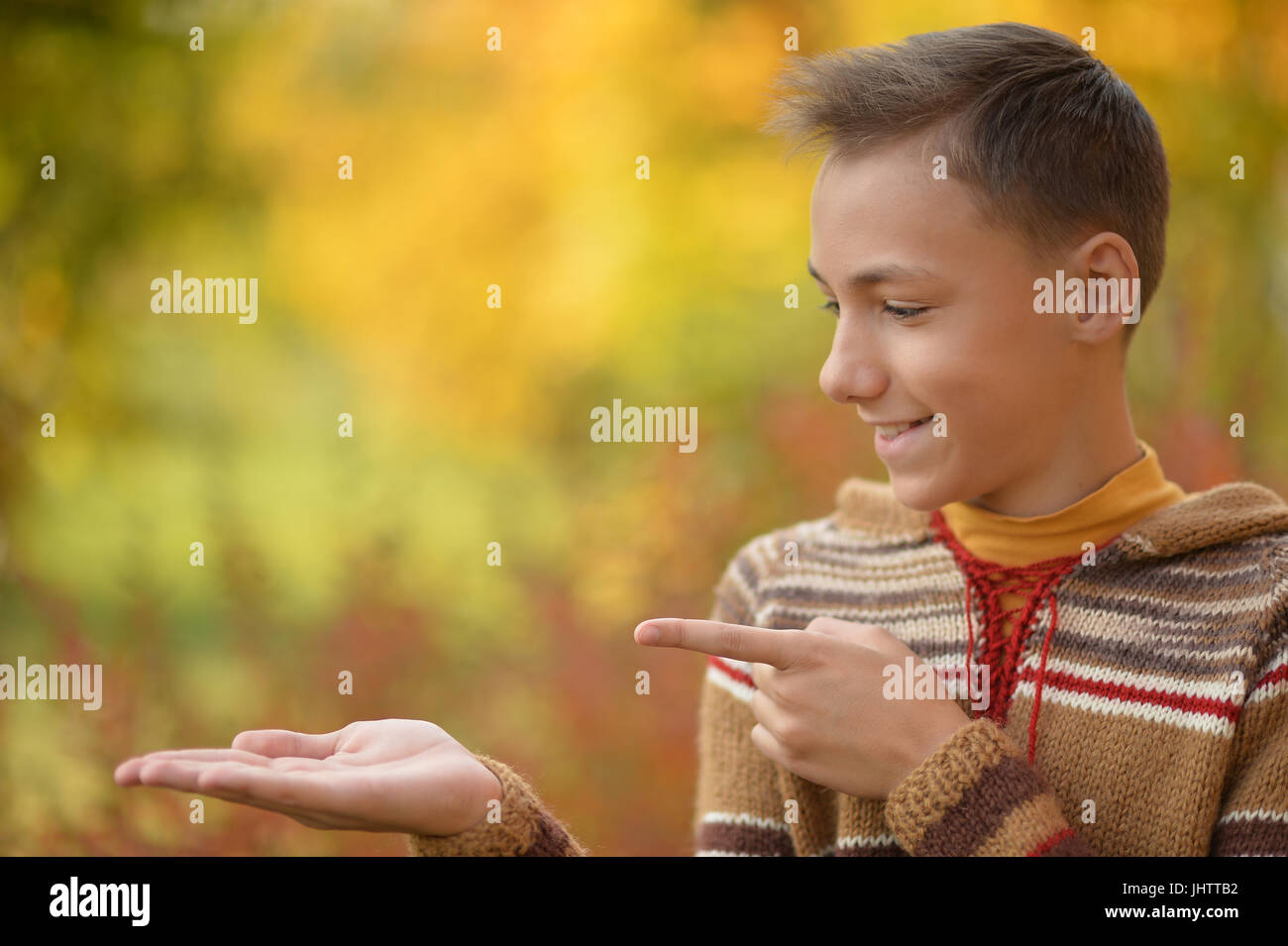 boy showing something Stock Photo - Alamy