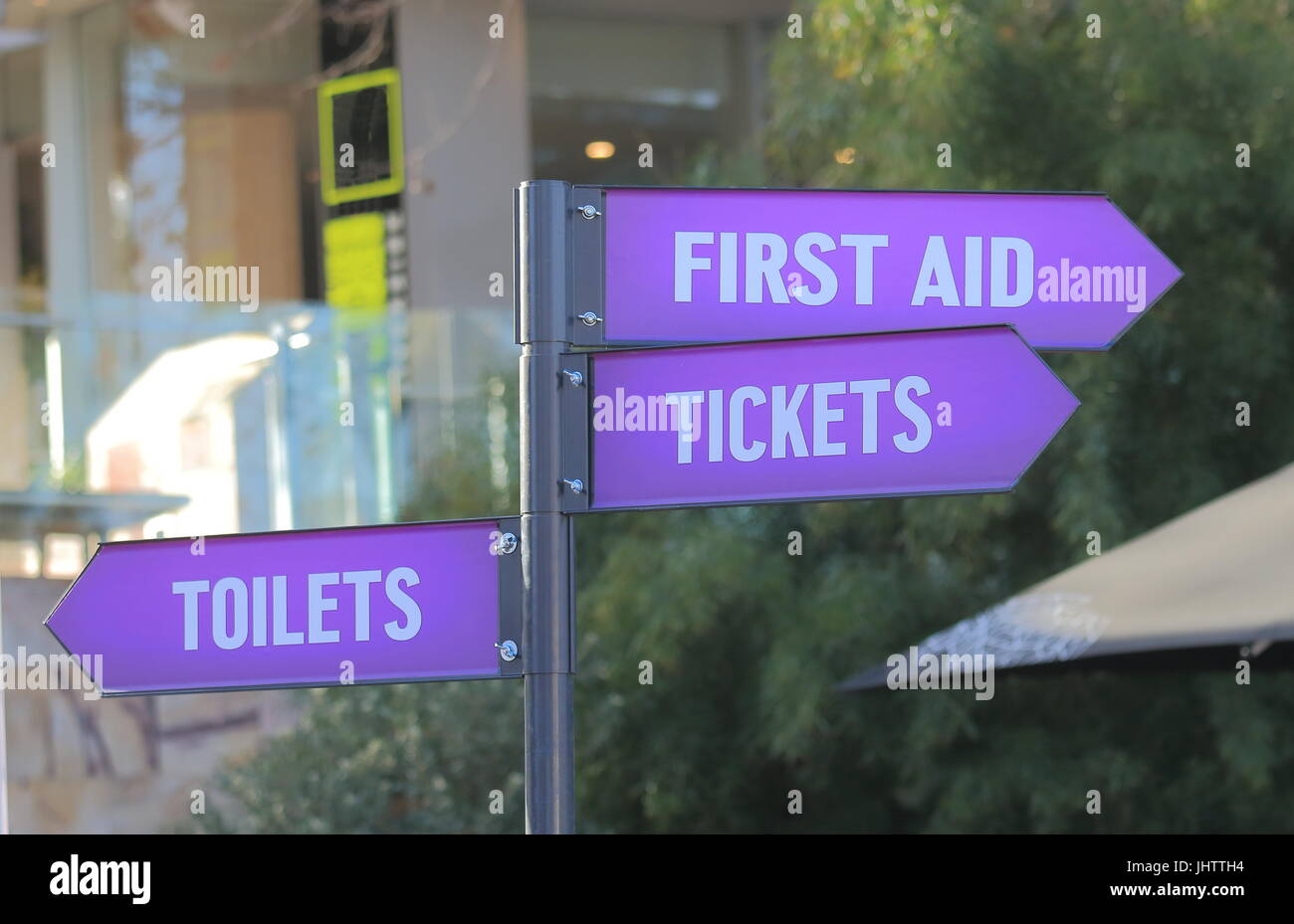 First aid ticket and toilet sign Stock Photo - Alamy