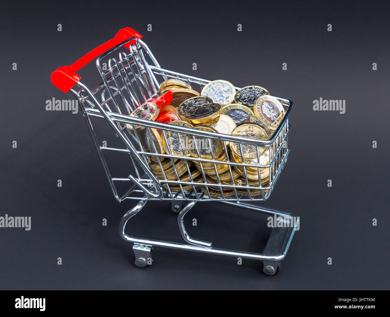 Shopping basket full on new one pound coins Stock Photo - Alamy
