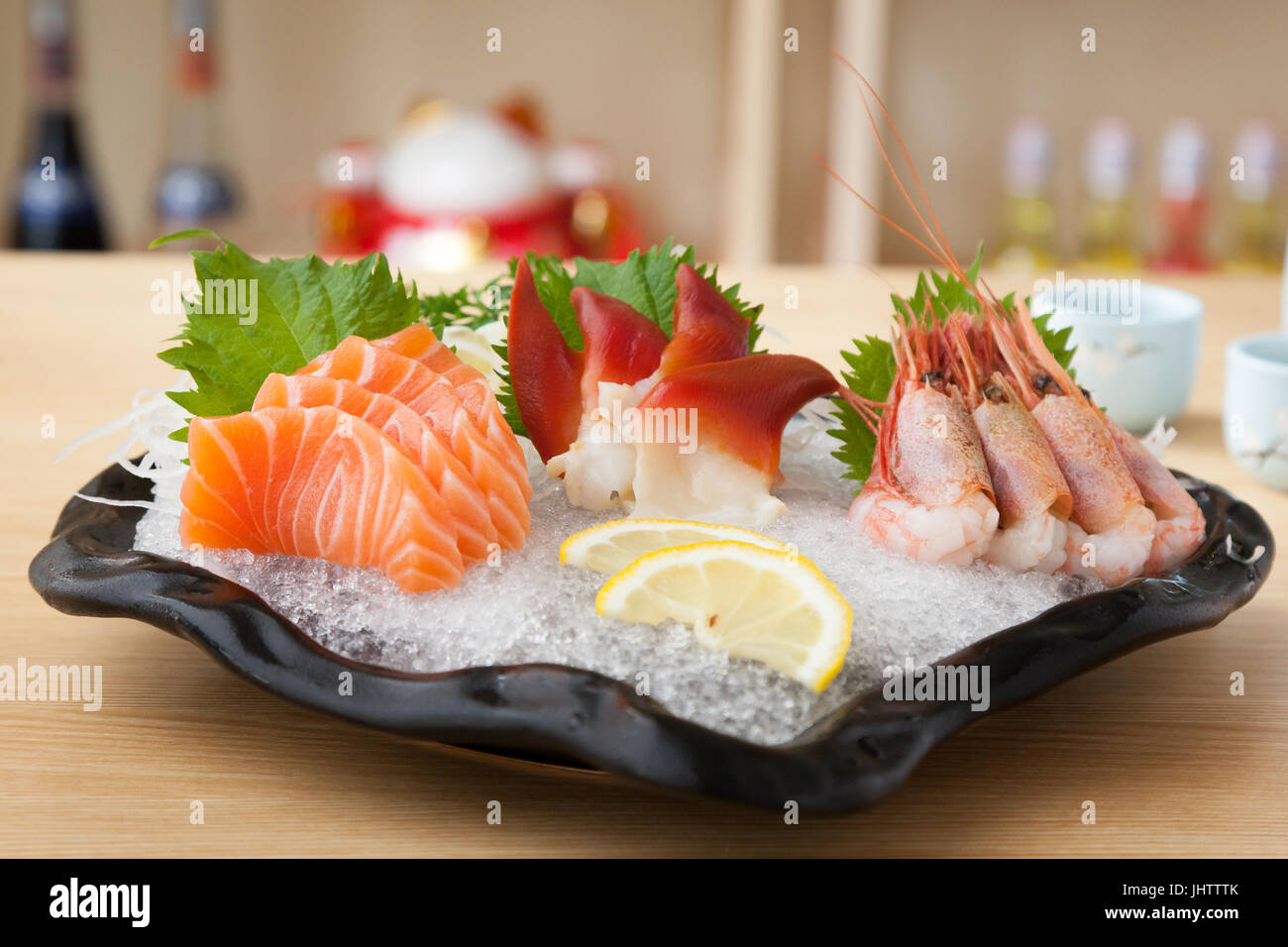 A Plate of Delicious Sashimi Platter on the Table Stock Photo - Alamy