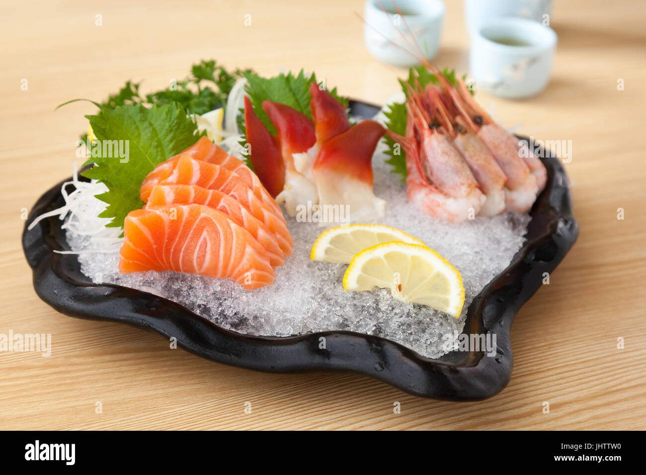A Plate of Delicious Sashimi Platter on the Table Stock Photo - Alamy
