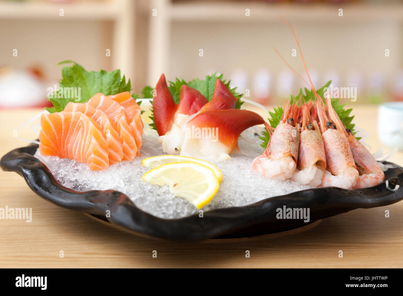 A Plate of Delicious Sashimi Platter on the Table Stock Photo - Alamy
