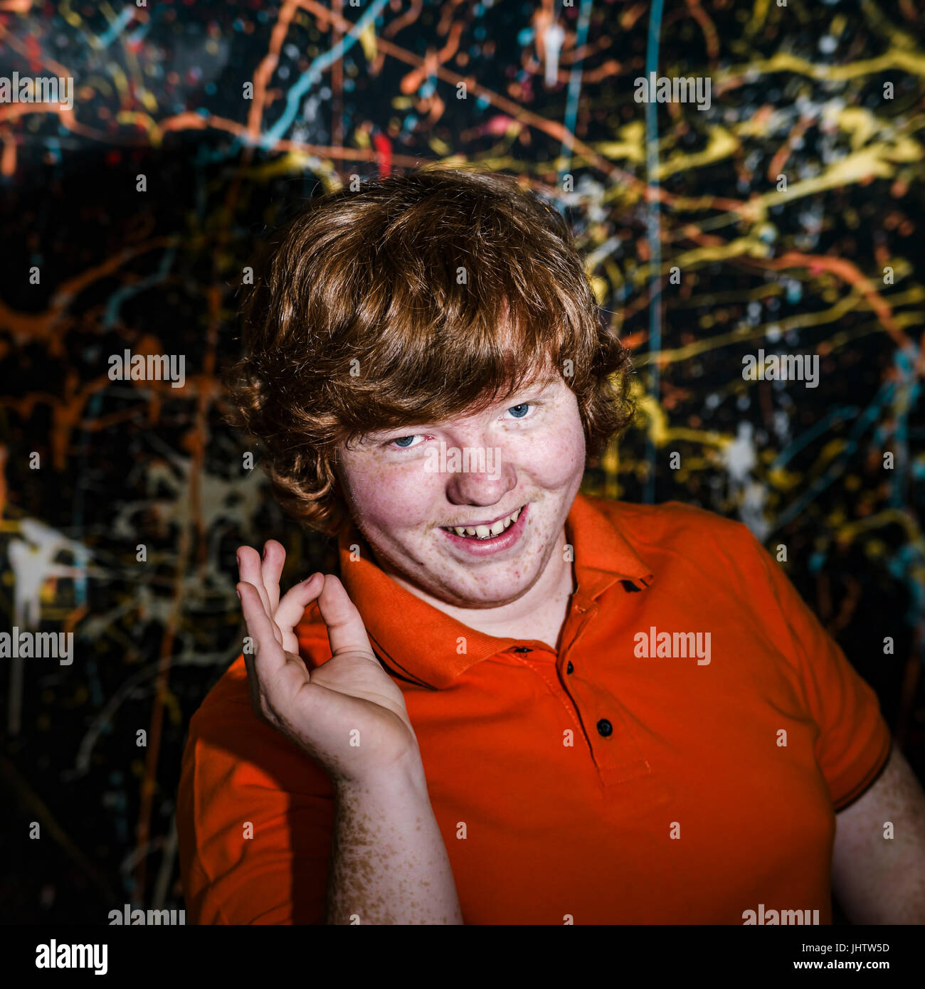 Funny red-haired boy showing ok sign, natural emotions Stock Photo - Alamy