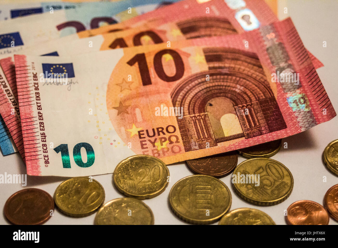 A composition of euro banknotes and coins providing great options to be ...