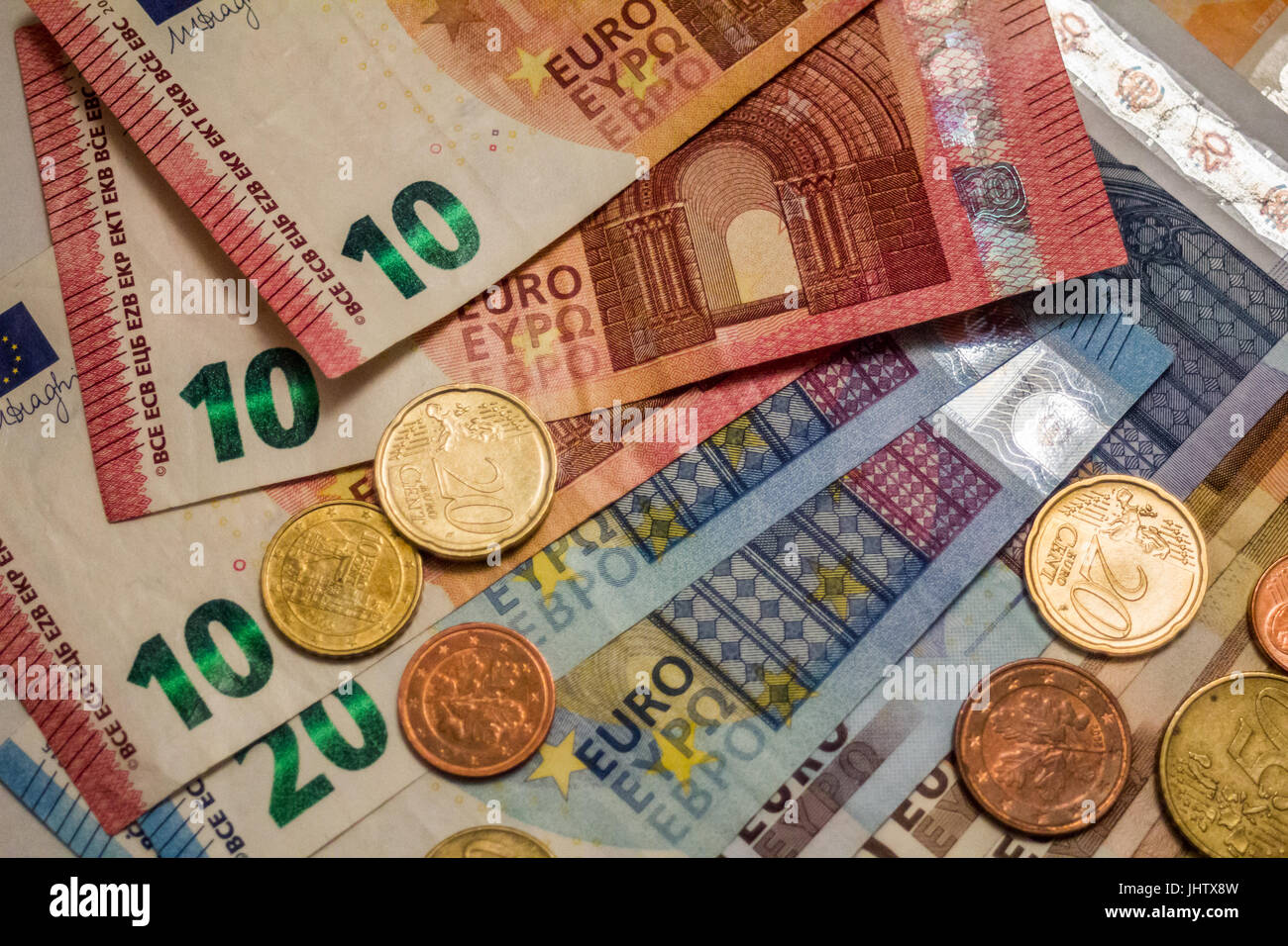 A composition of euro banknotes and coins providing great options to be ...