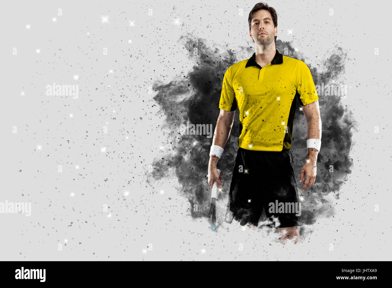 Tennis Player with a yellow uniform coming out of a blast of smoke ...