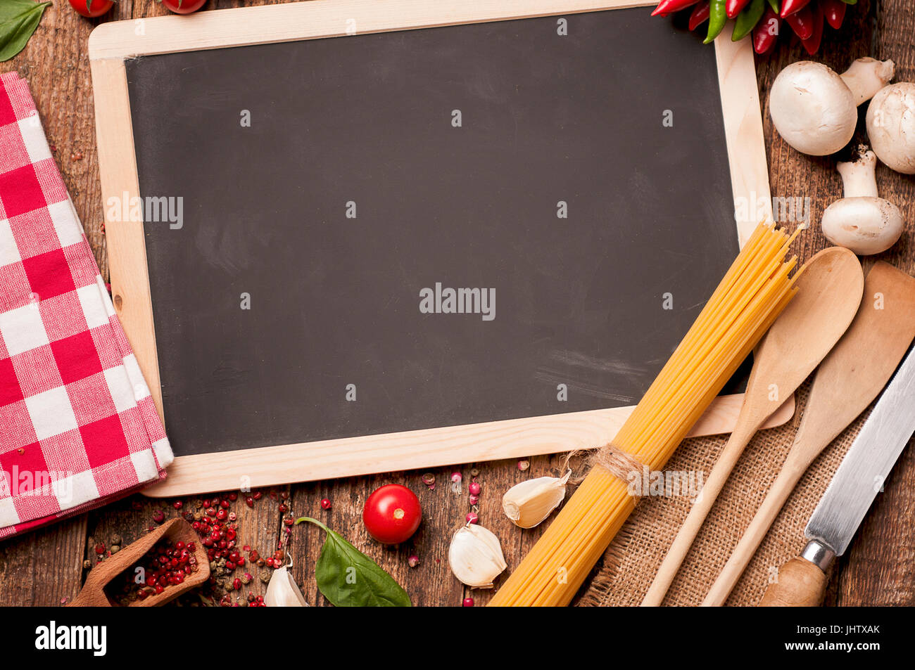 Pasta cooking background with chalkboard, tomatoes, basil and olive oil ...