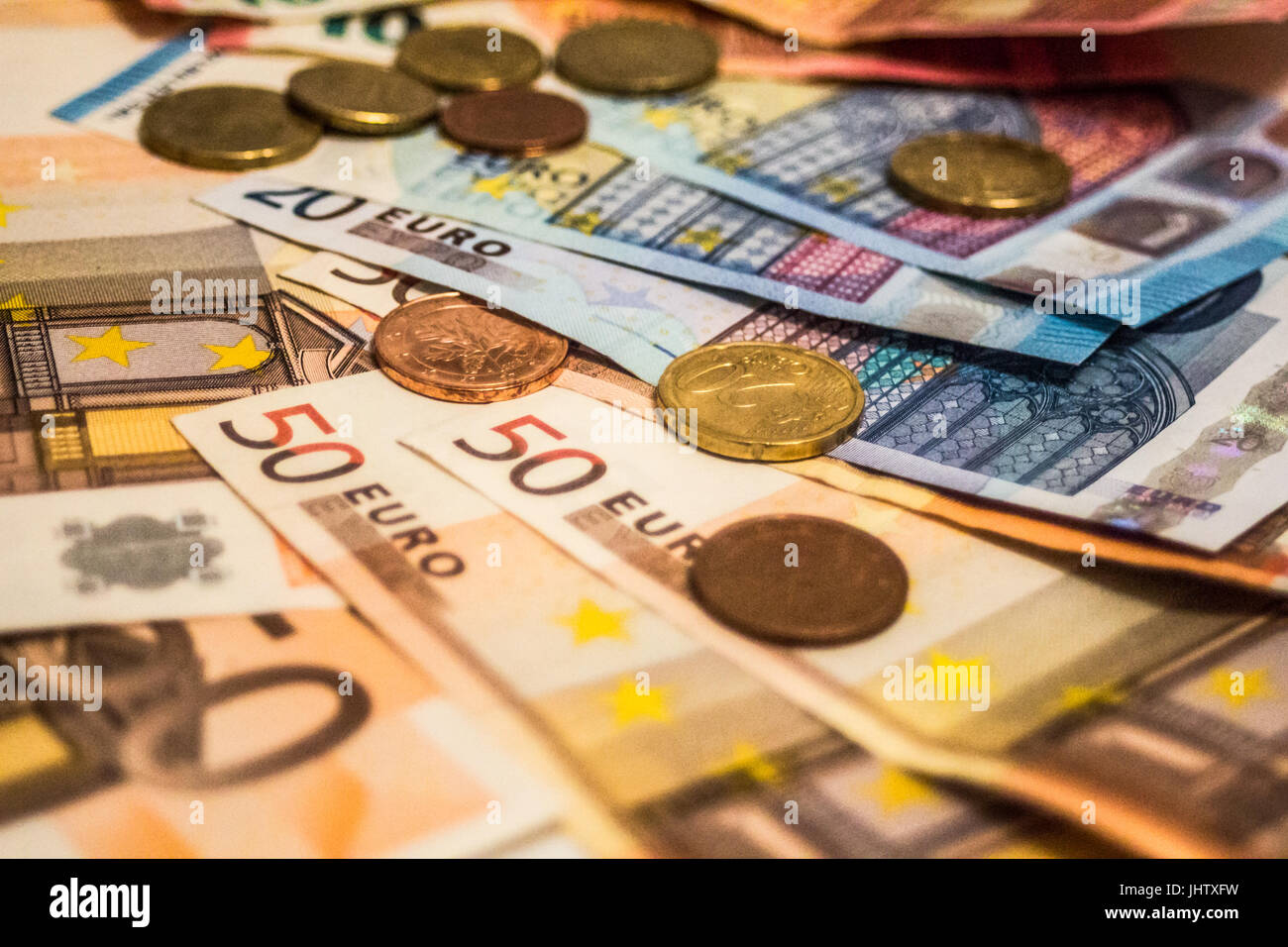 A composition of euro banknotes and coins providing great options to be ...