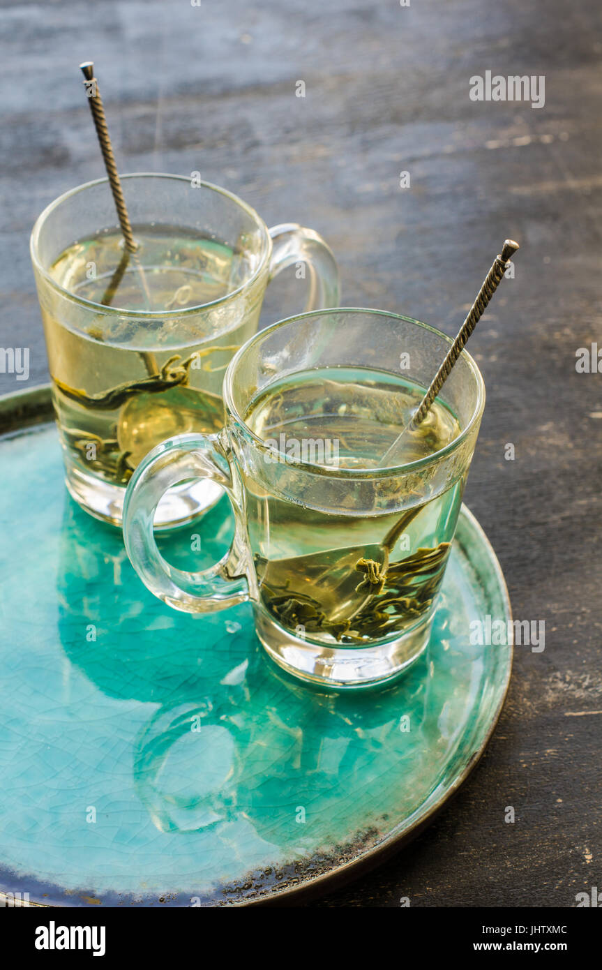 Green tea set on dark wooden rustic table Stock Photo - Alamy