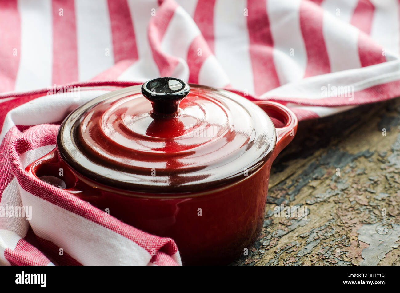 Cooking pot and napkin on rustic woodn background Stock Photo - Alamy