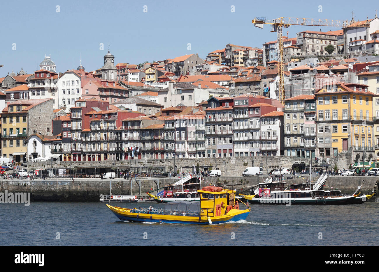 Colorful tour boats Barcos Rabelos sail the Douro River by Ribeira ...