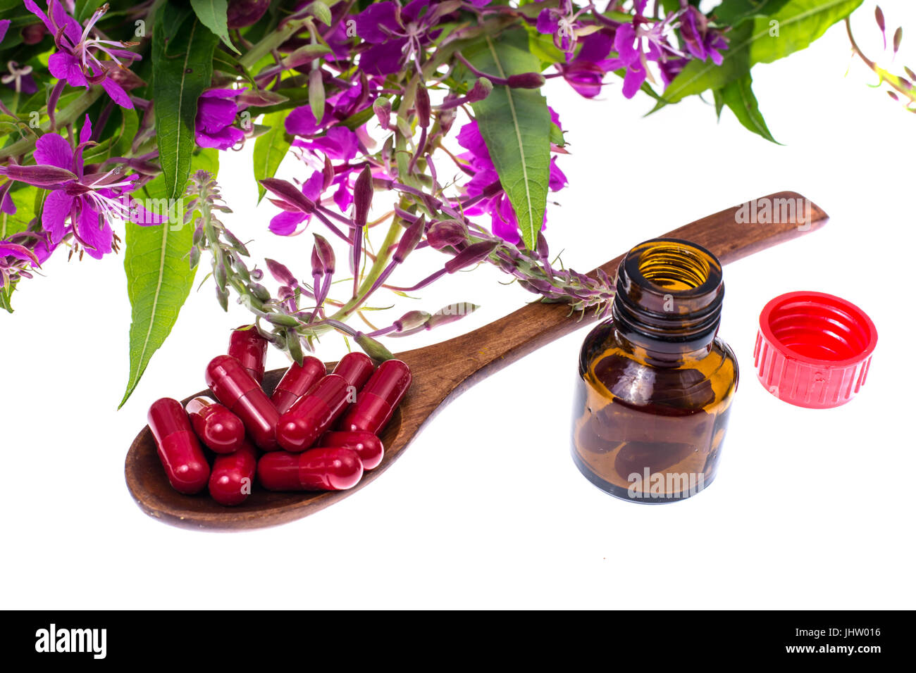 Homeopathy. Herbal capsules, medicinal plants on white background ...