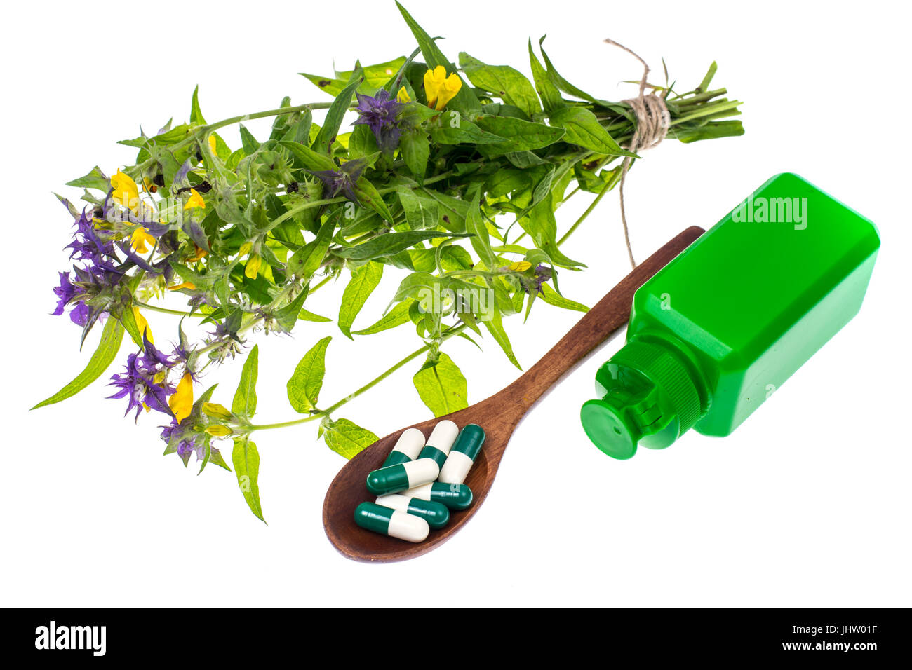 Homeopathy. Herbal capsules, medicinal plants on white background ...