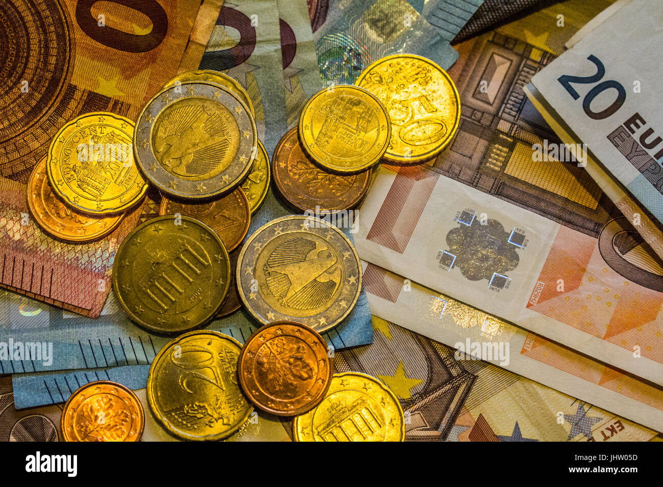 A composition of euro banknotes and coins providing great options to be ...