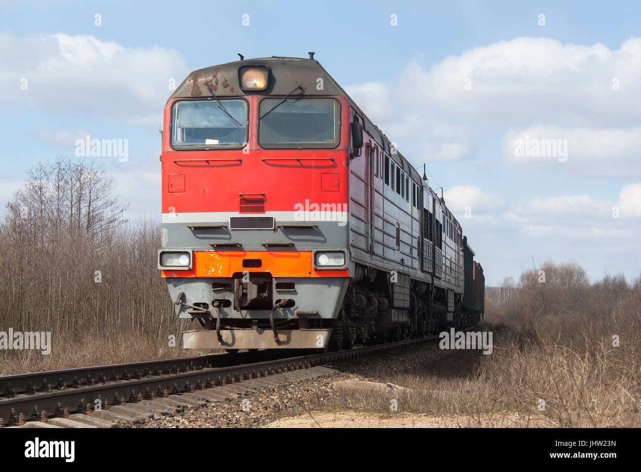 red locomotive of freight train Stock Photo - Alamy