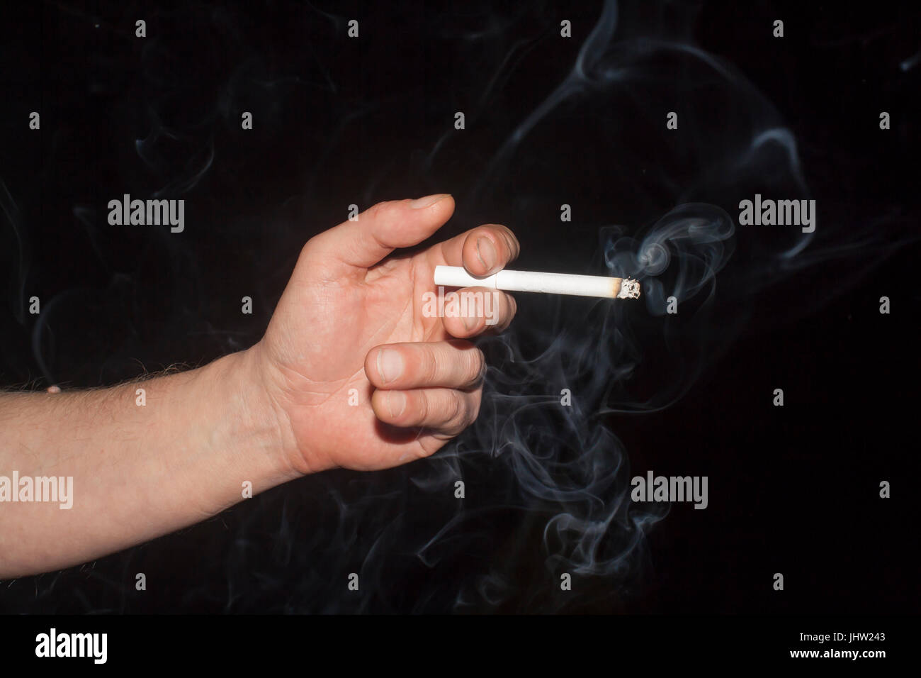 hand of smoker with cigarette Stock Photo - Alamy