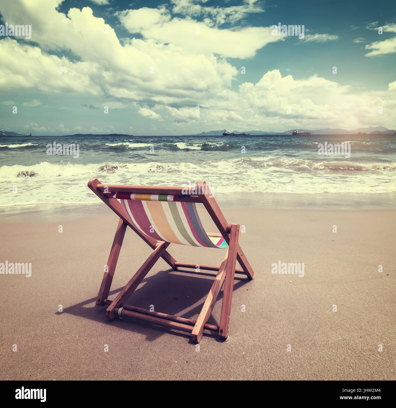 Deck chair at the tropical beach Stock Photo - Alamy
