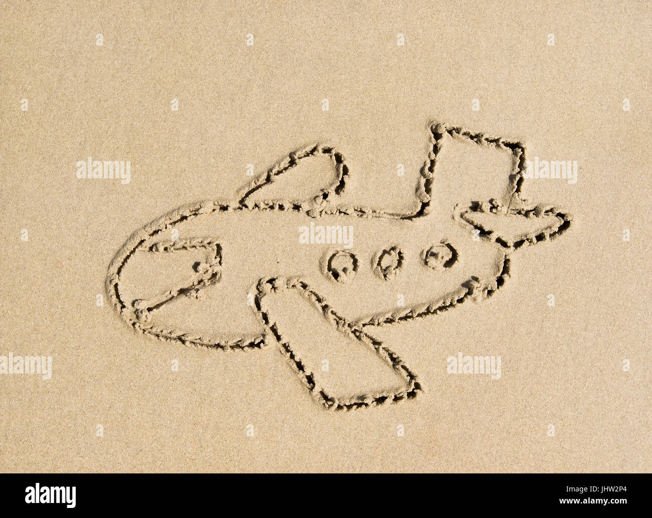 plane drawing in the sand on the beach Stock Photo - Alamy