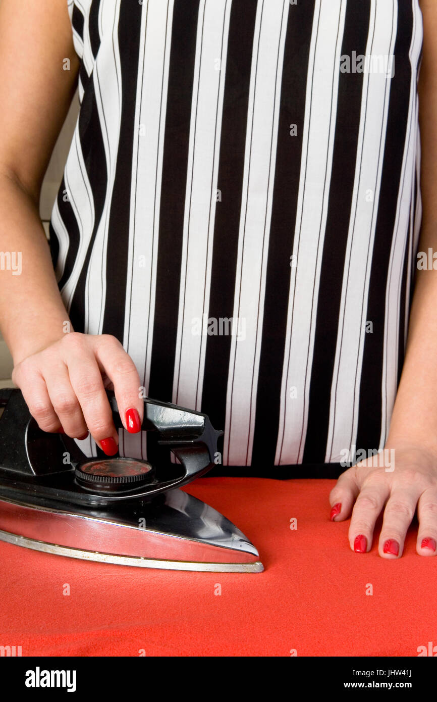 Ironing clothes hi-res stock photography and images - Alamy