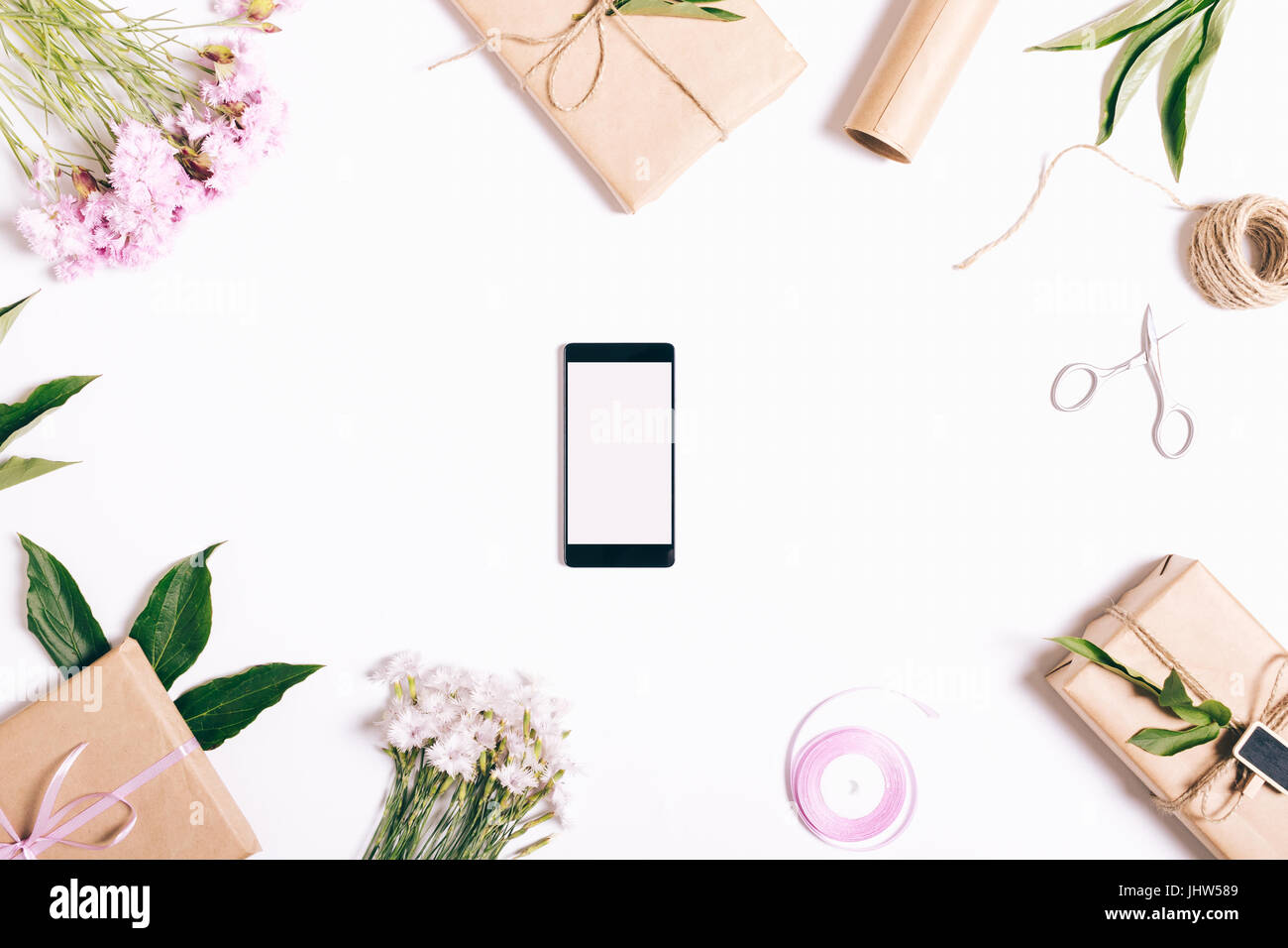 Mobile phone lying on the table with decorations, top view Stock Photo ...