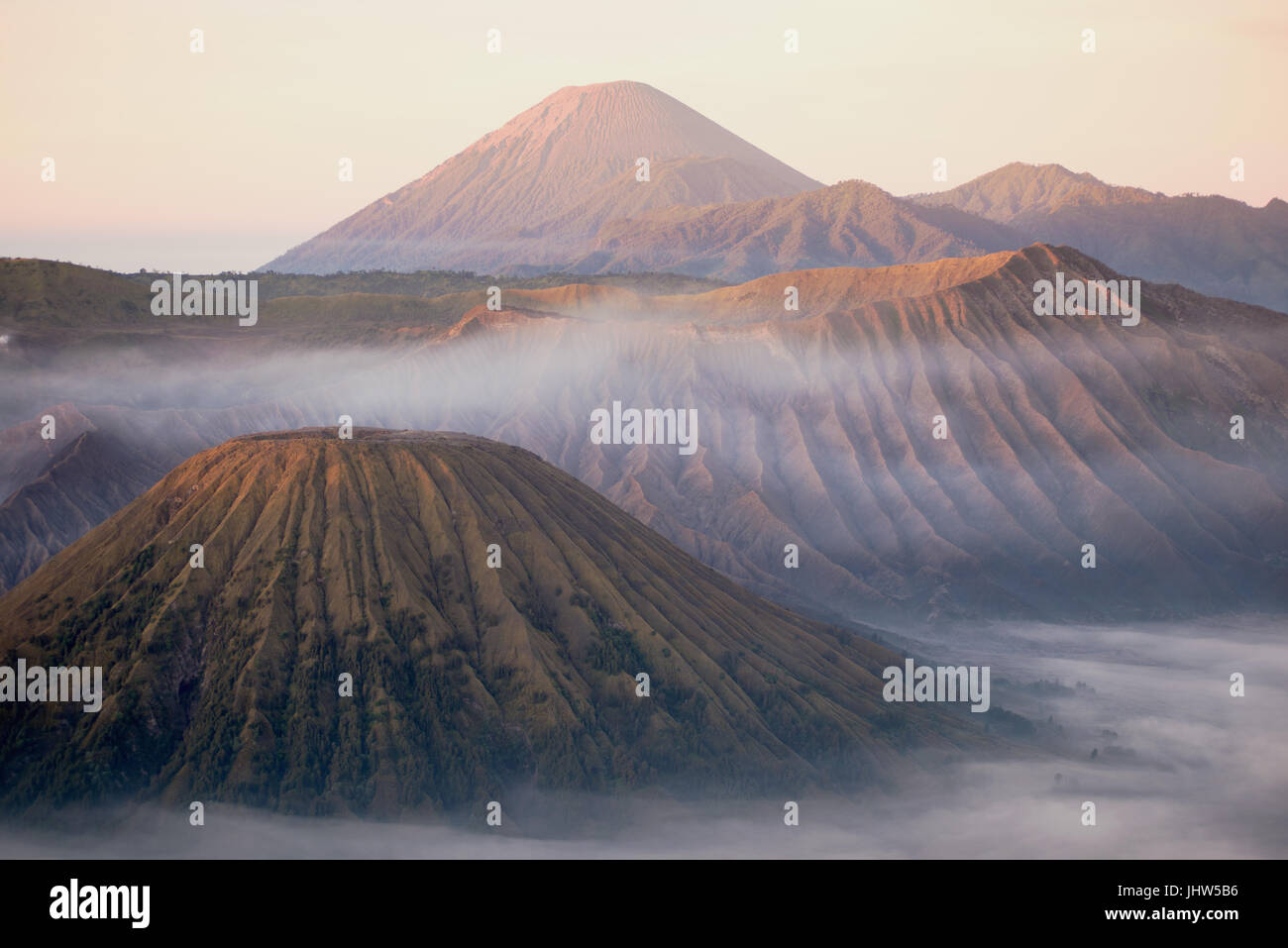 Scenic view of Mount Bromo and Mount Semeru active volcanos at sunrise ...