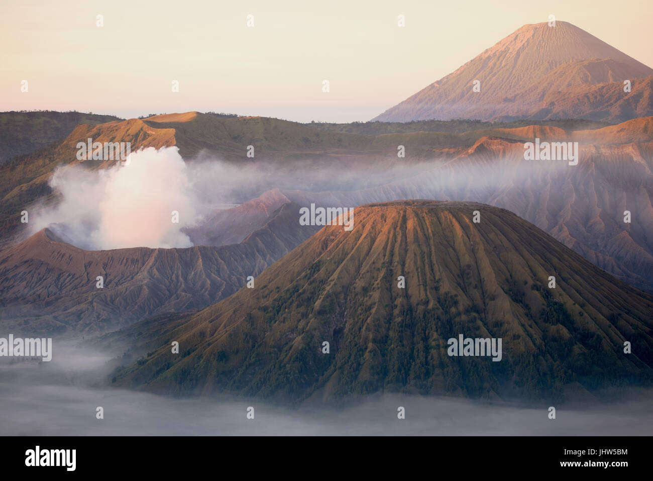 Scenic view of Mount Bromo and Mount Semeru active volcanos at sunrise ...