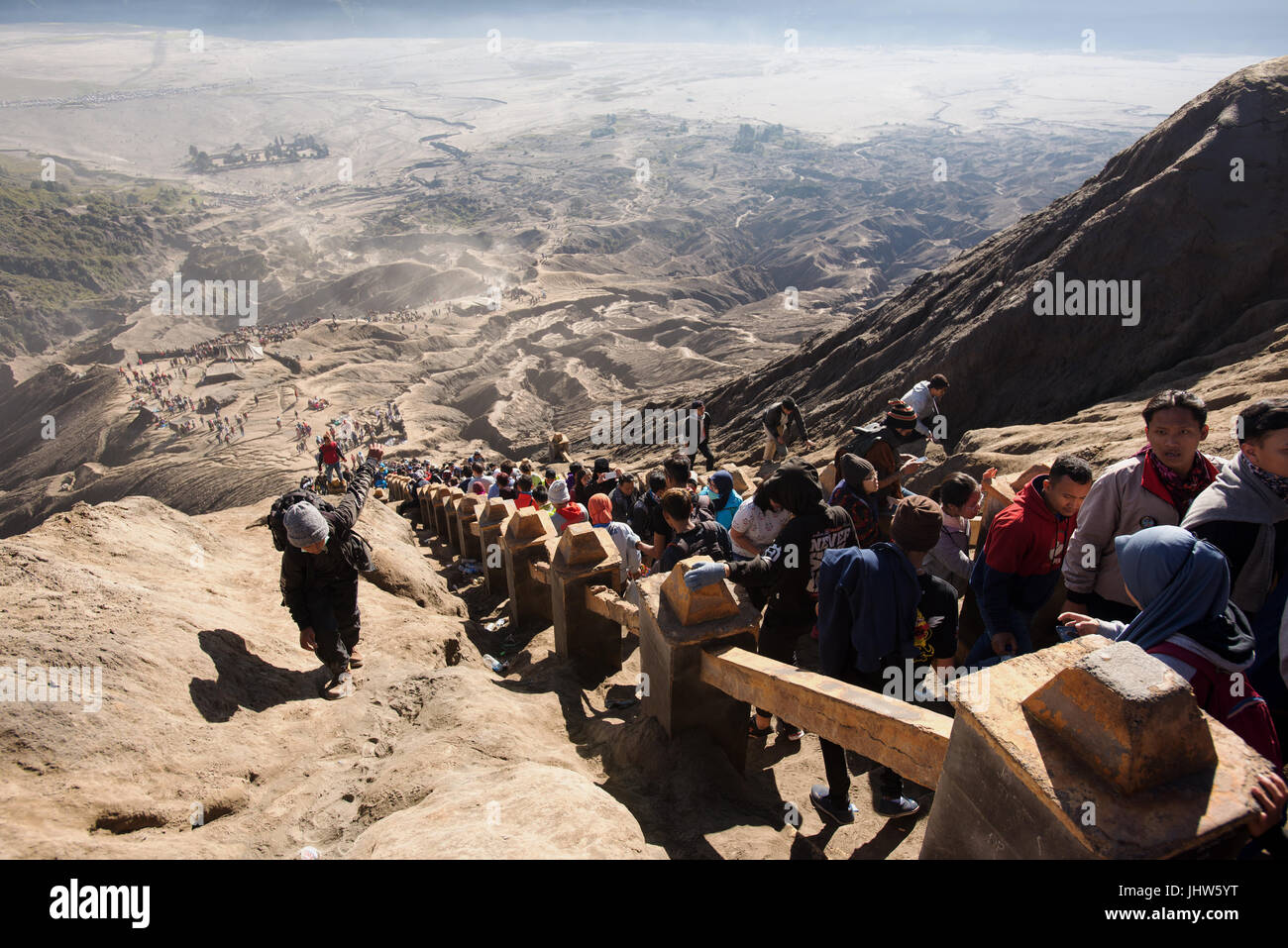 Tourists climbing to crater of Mount Bromo active volcano, East Java ...