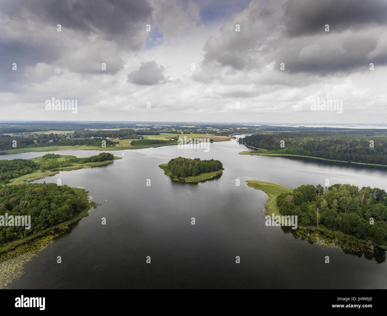 Aerial view of green islands and clouds at summer sunny morning ...
