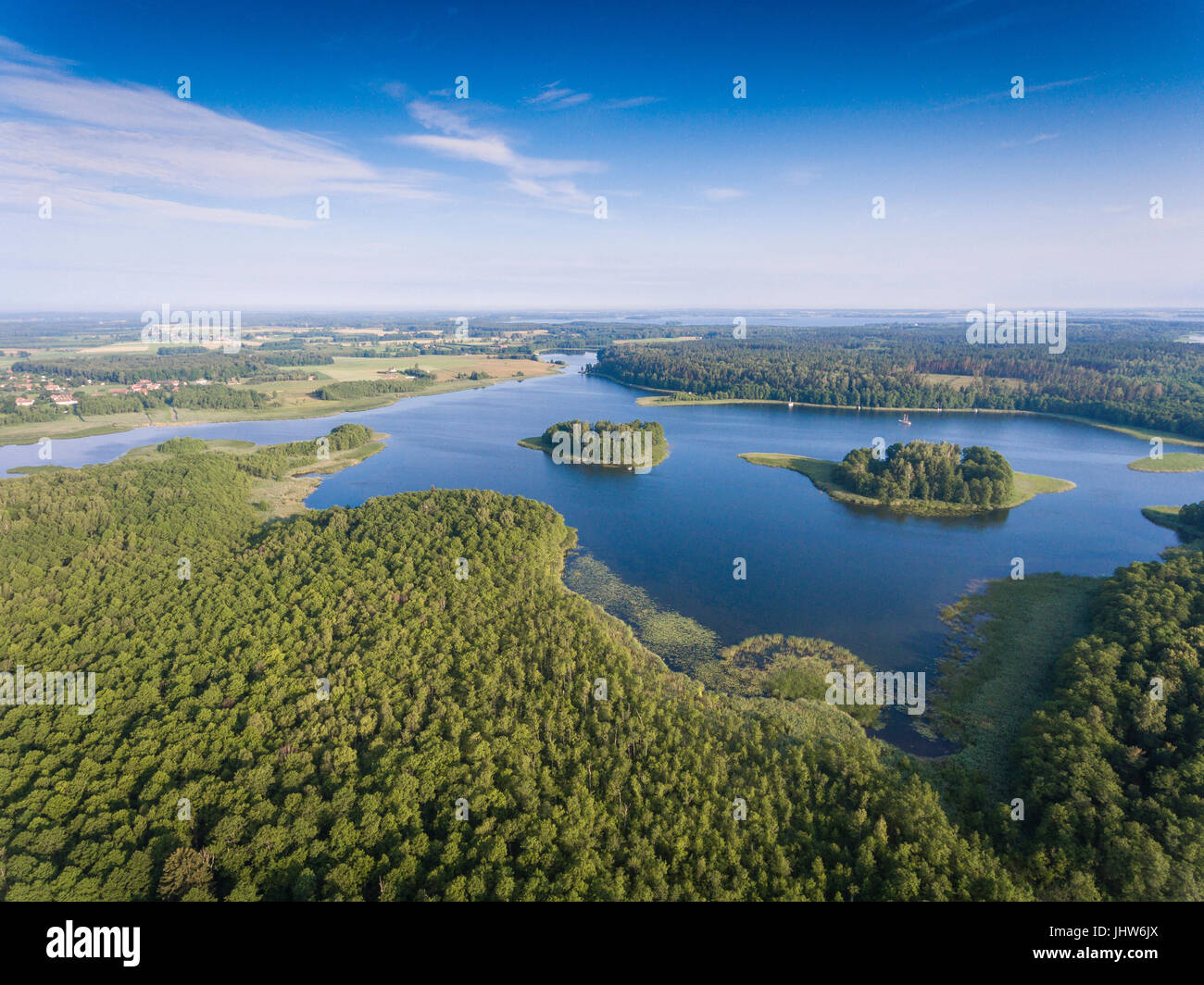 Aerial view of green islands and clouds at summer sunny morning ...